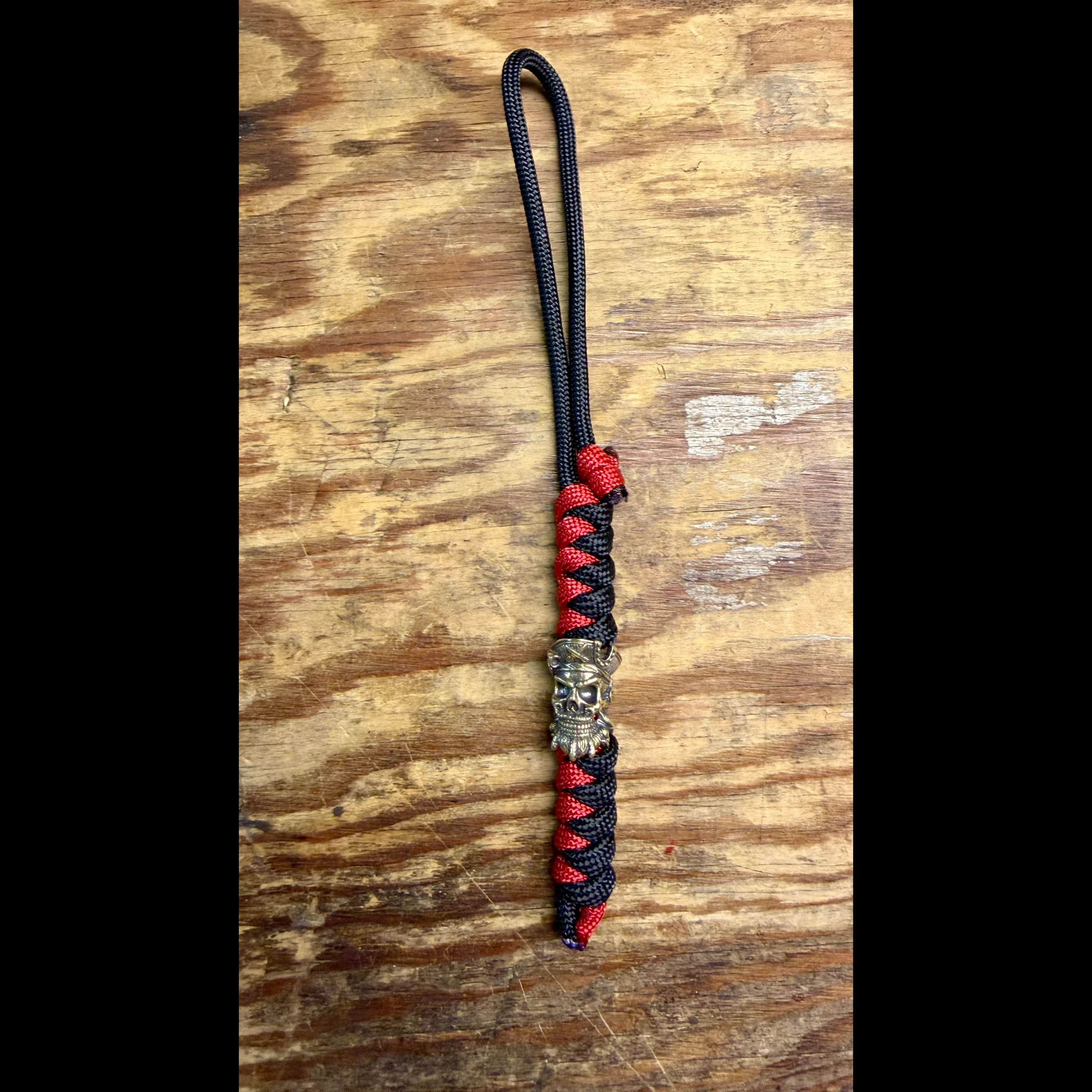 Bladebinge - Captain Kidd brass bead on a UV reactive red and black ...