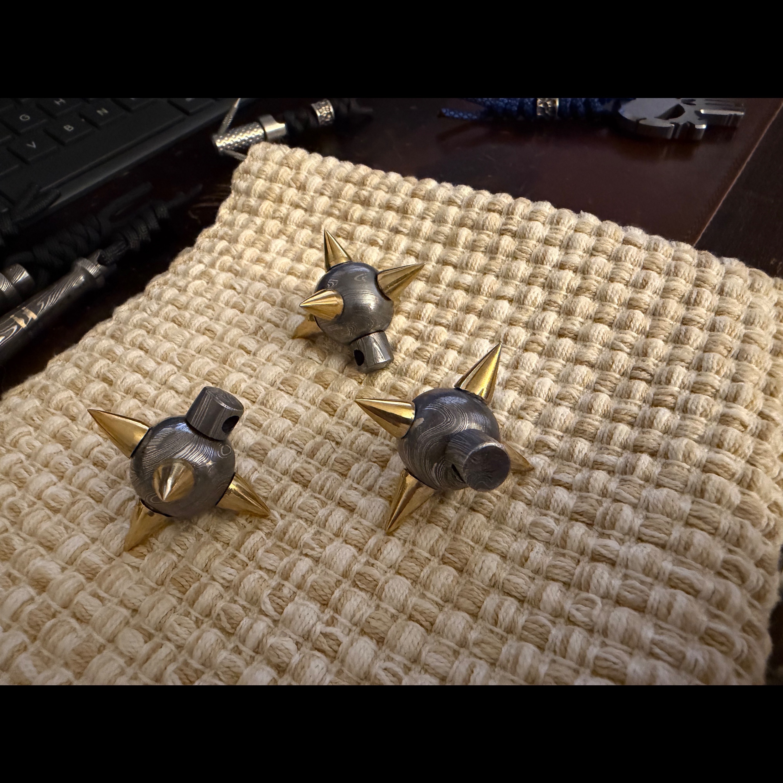 Bladebinge - Damascus orbs with bronze spikes